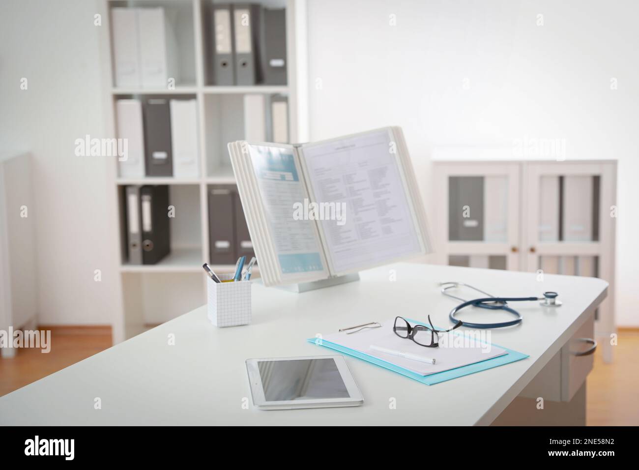 Doctor's workplace with tablet and stationery in medical office Stock ...
