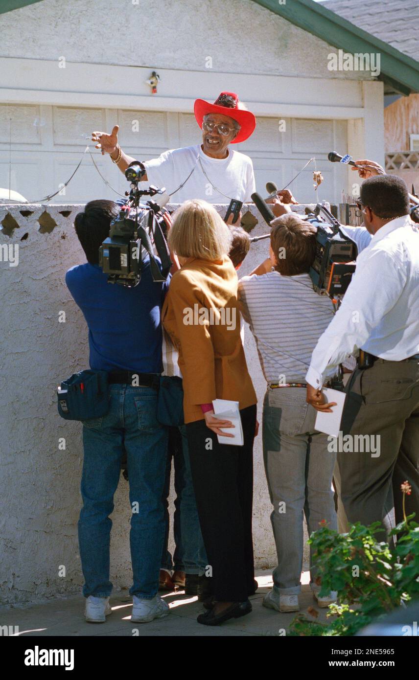 Henry Watson Sr., father of defendant Henry Watson, talks to reporters ...