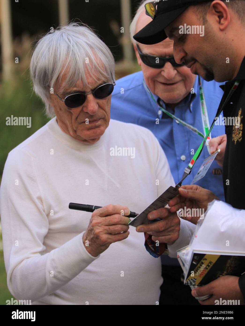 Bernie Ecclestone, president and CEO of the Formula One managment, signs autographs at the ...