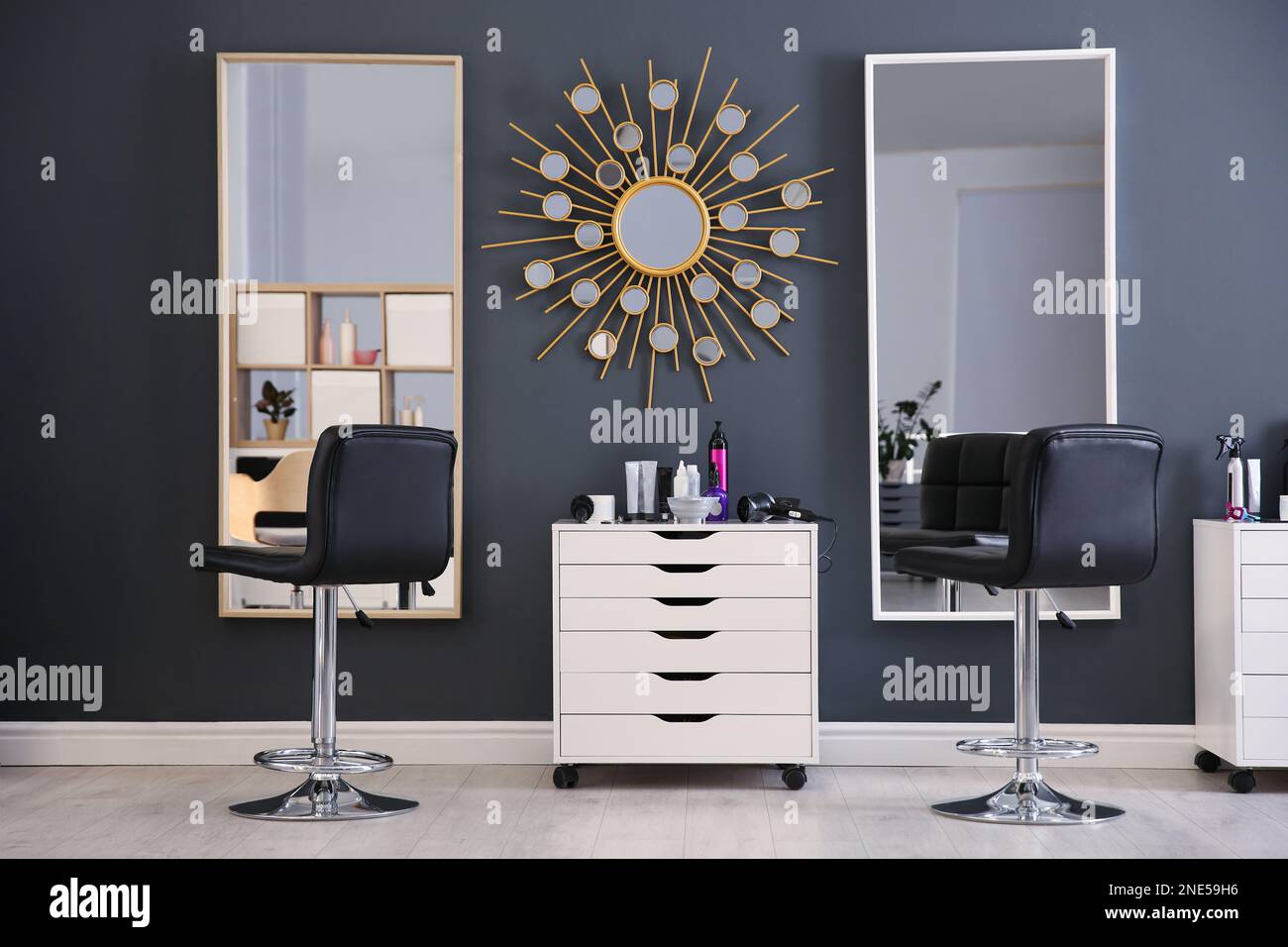 Stylish interior with hairdresser's workplace in beauty salon Stock ...
