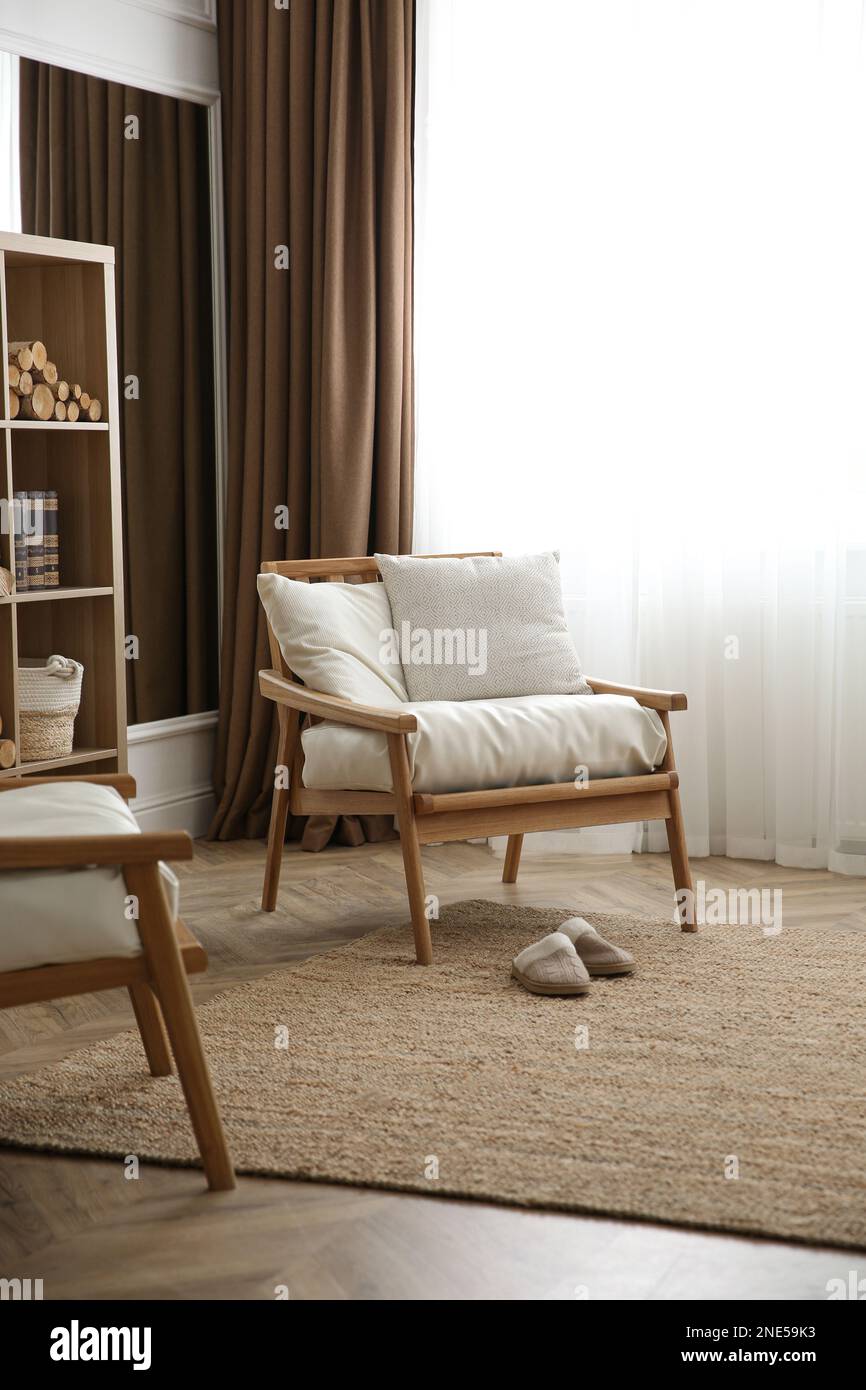 Armchair near window in modern room. Interior design Stock Photo - Alamy