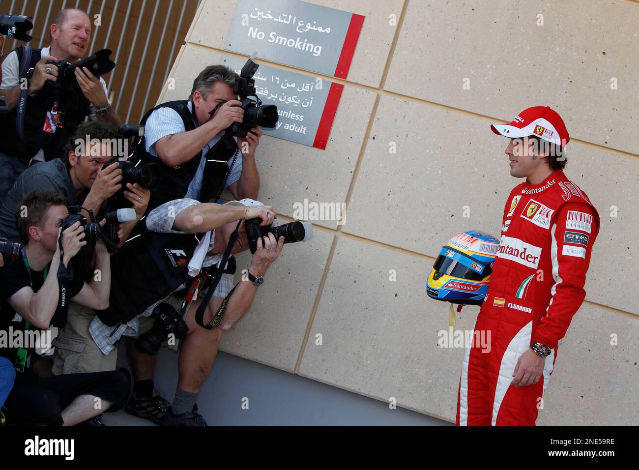 Ferrari driver Fernando Alonso of Spain poses for photographers at the ...