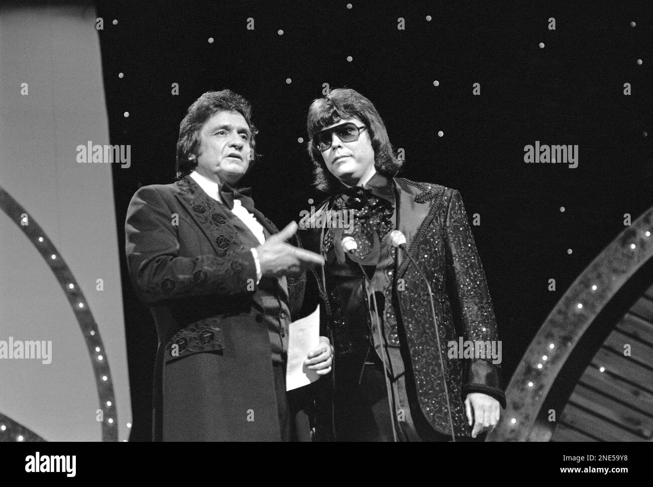 Johnny Cash, left, and Ronnie Milsap are shown at the Country Music ...