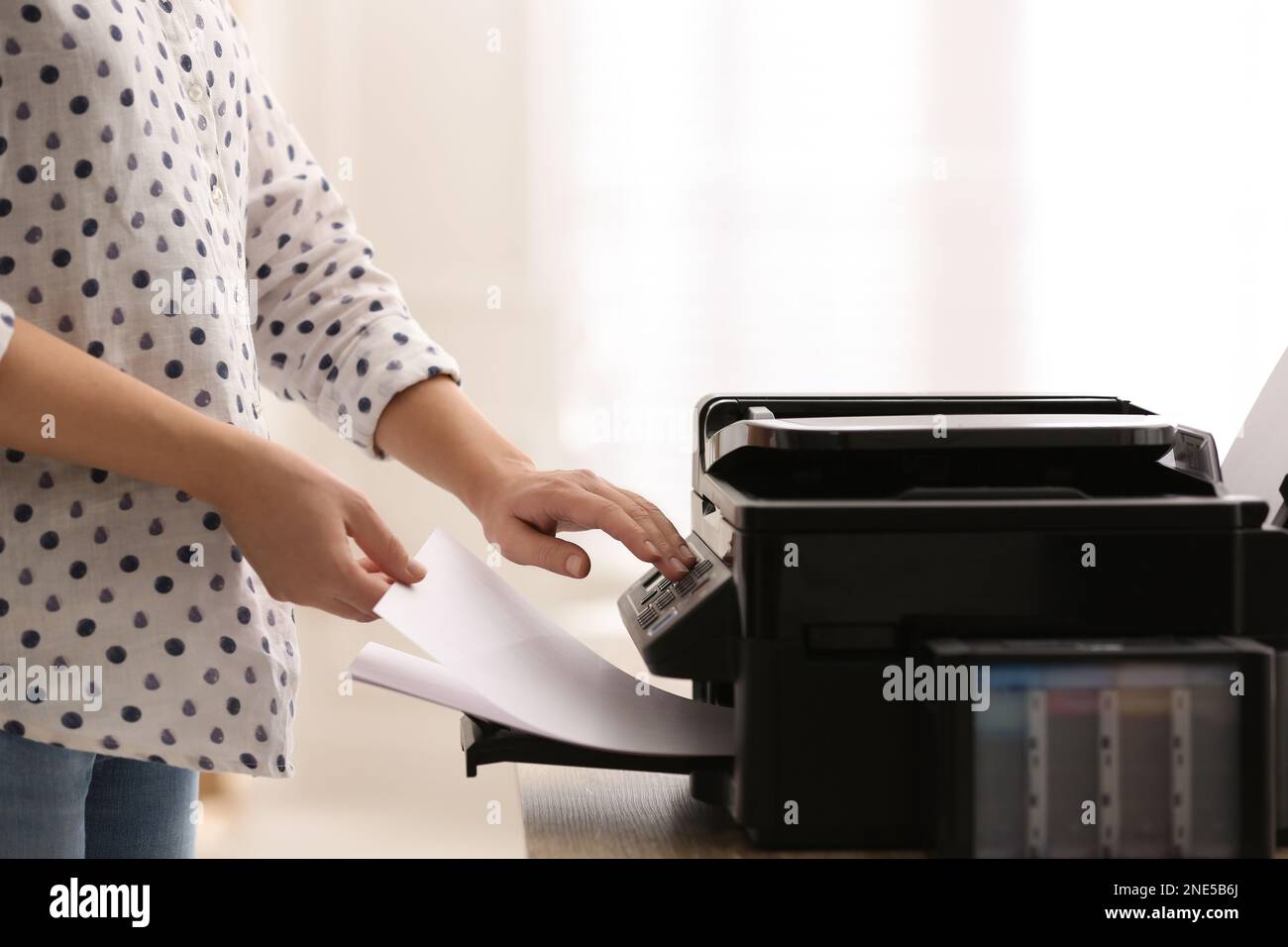 Employee using modern printer in office, closeup Stock Photo - Alamy