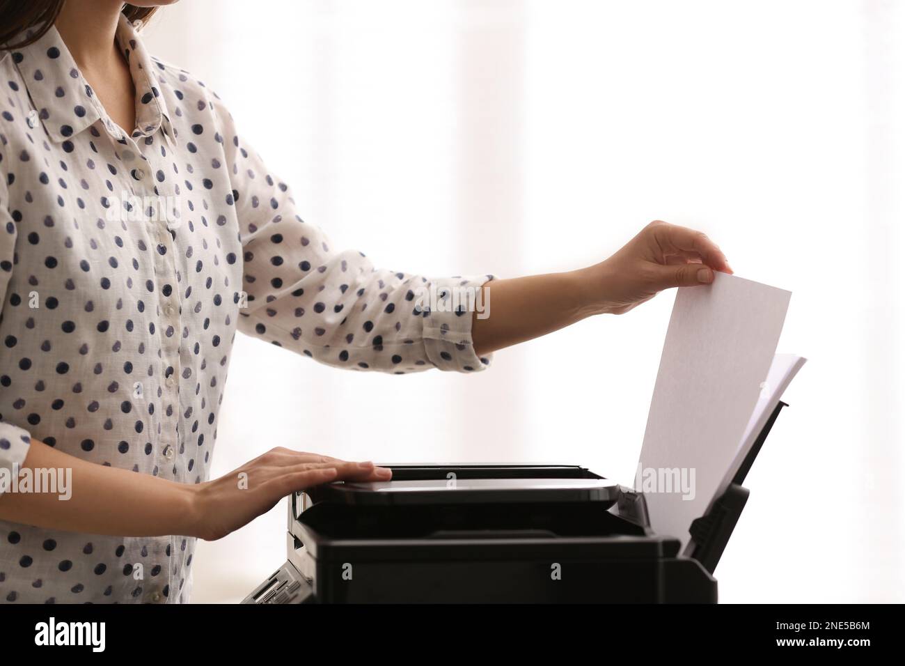 Employee using modern printer in office, closeup Stock Photo - Alamy