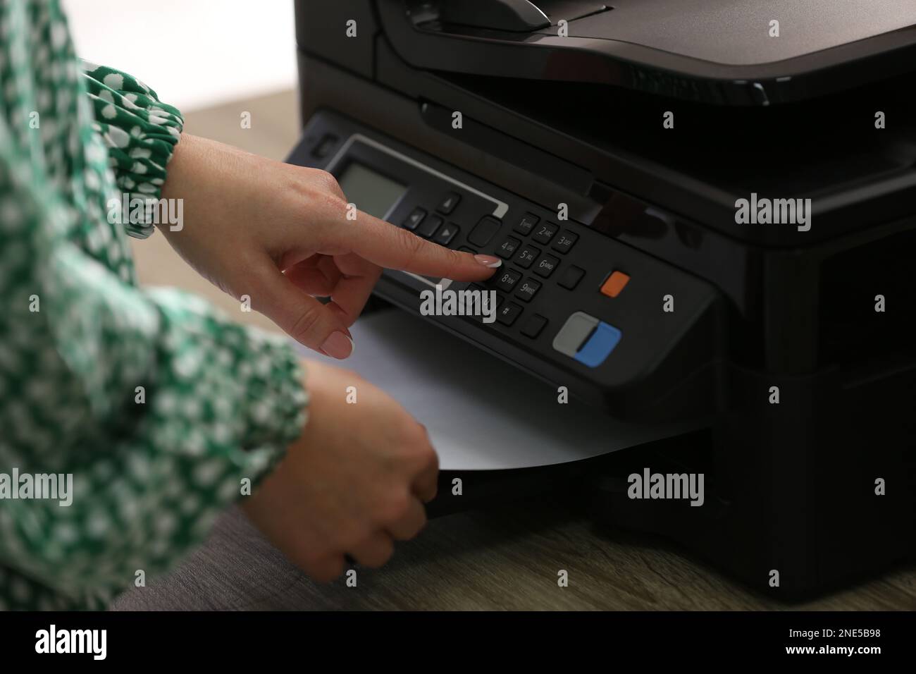 Person using multifunction printer hi-res stock photography and images ...