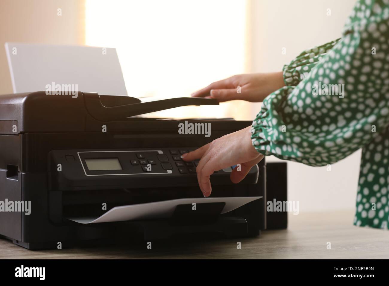 Person using multifunction printer hi-res stock photography and images ...