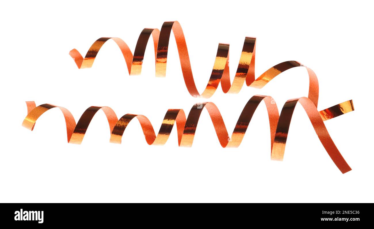 Shiny serpentine streamers on white background. Festive decor Stock ...