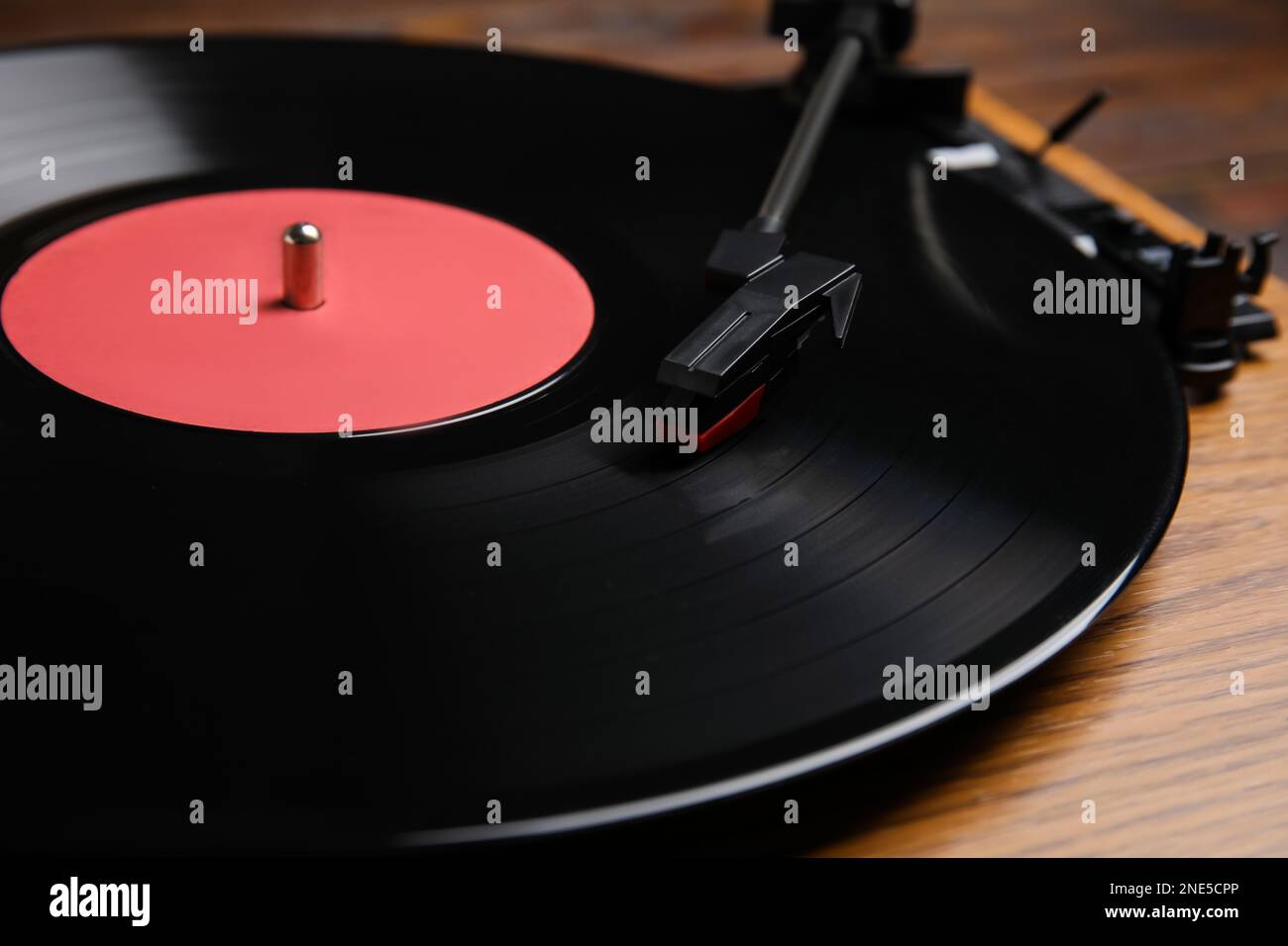 Modern vinyl record player with disc on table, closeup Stock Photo - Alamy