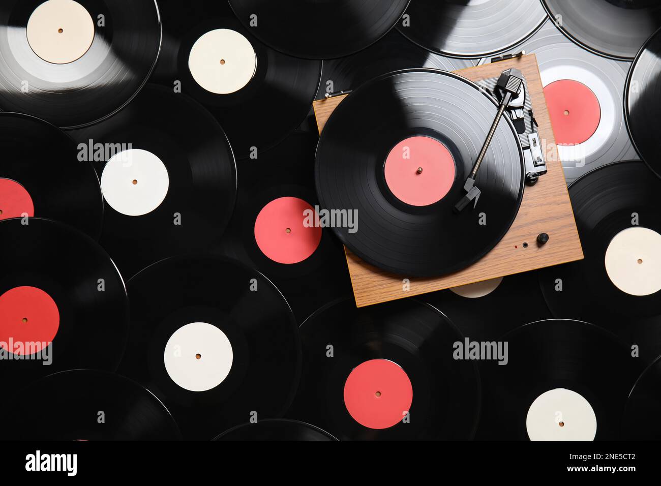 Modern player on vintage vinyl records, top view Stock Photo - Alamy