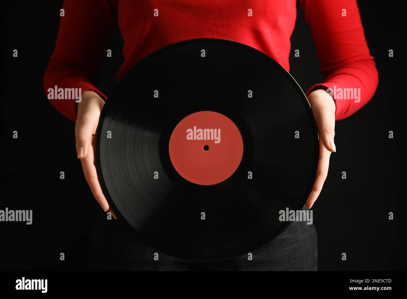 Woman holding vinyl records hi-res stock photography and images - Alamy