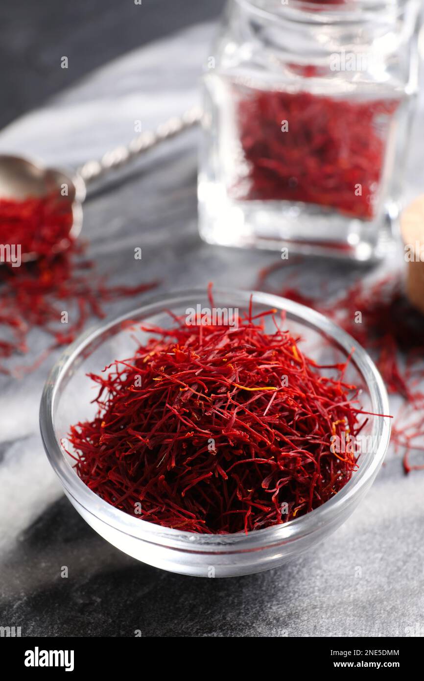 Dried saffron on grey marble board, closeup Stock Photo - Alamy