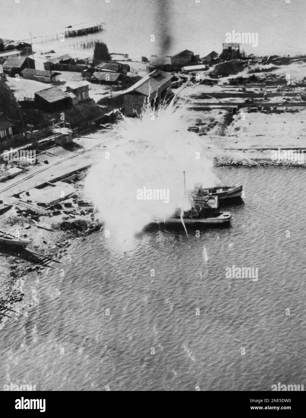 The napalm bomb spreads its fiery destruction in a mantle of flame over ...