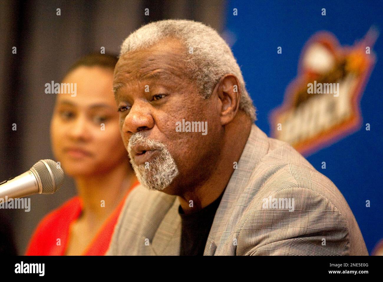 Tulsa Shock coach Nolan Richardson, right, addresses the media during a ...