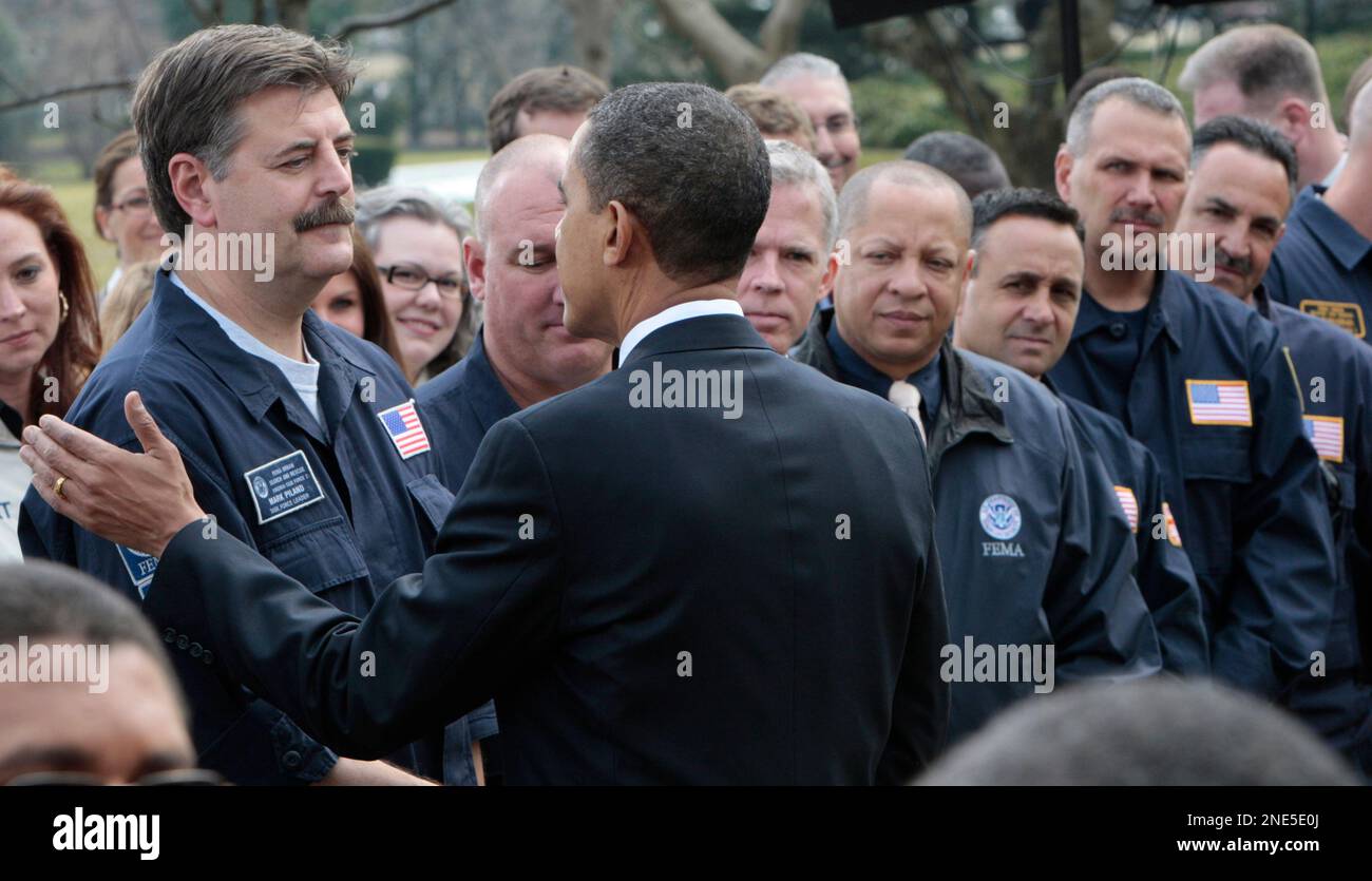 President Barack Obama greets Mark Pilano, left, Task Force Leader FEMA ...