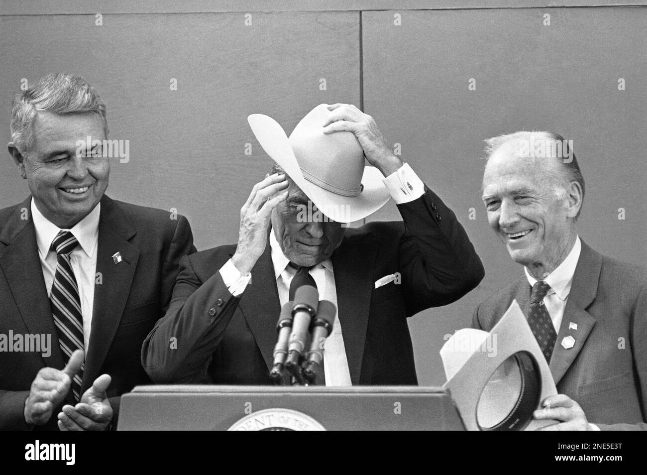 President Ronald Reagan, left, and Congressman Jim Collins prepare to ...