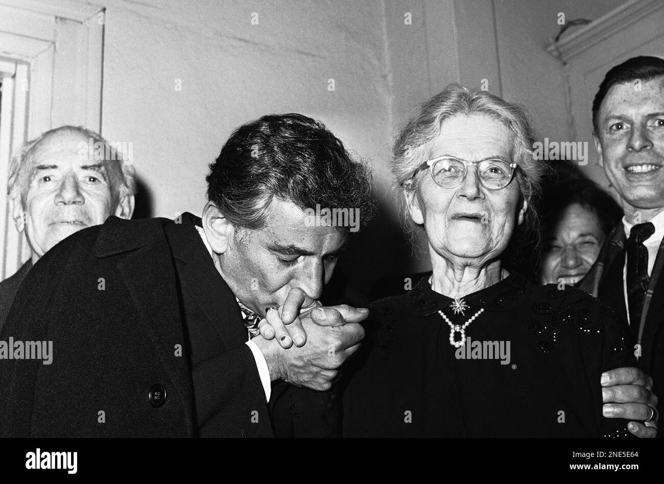 Leonard Bernstein, conductor of New York Philharmonic Orchestra, kisses ...