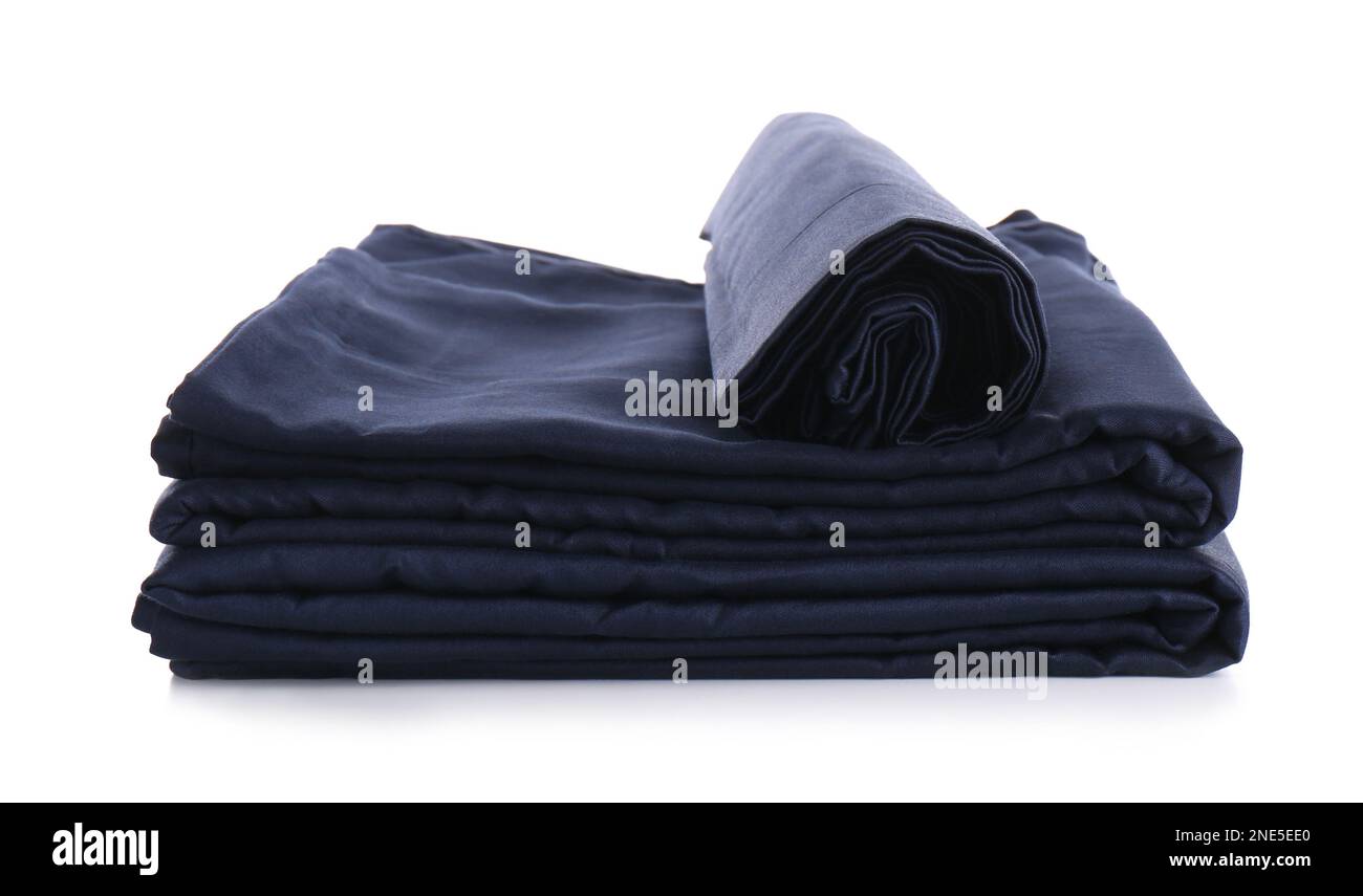 Stack of clean silky bed linen isolated on white Stock Photo - Alamy