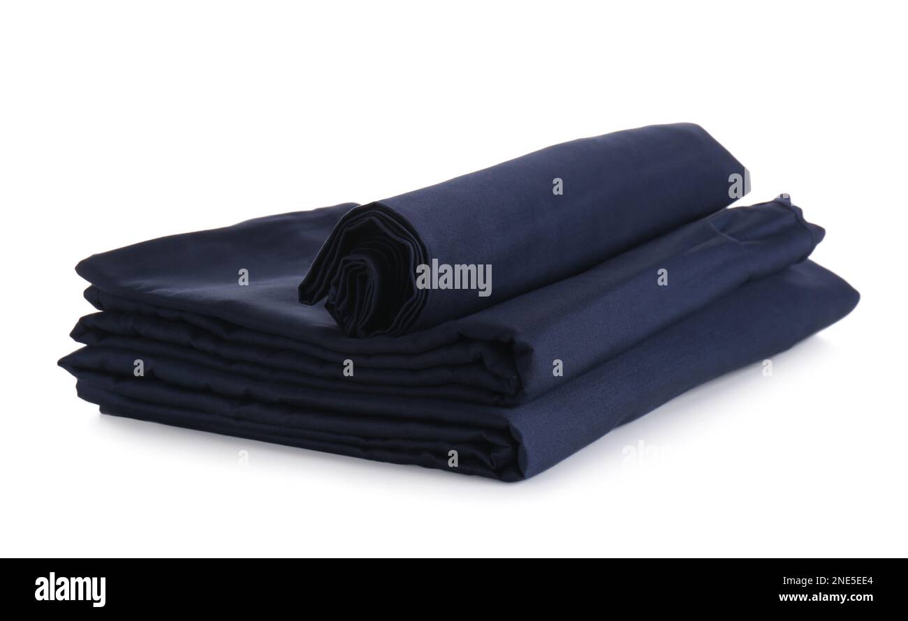 Stack of clean silky bed linen isolated on white Stock Photo - Alamy