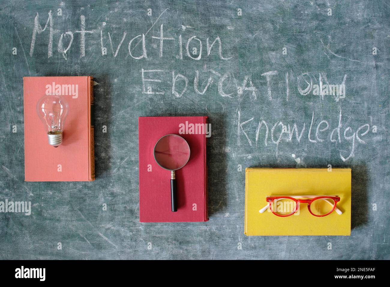 motivation,education,knowledge, books and blackboard with slogan ...