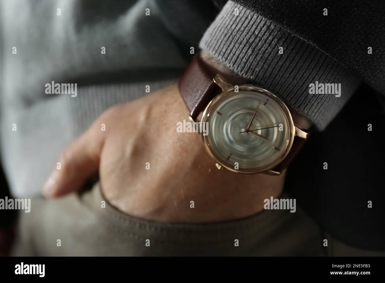 Elegant man wearing watch hi-res stock photography and images - Alamy