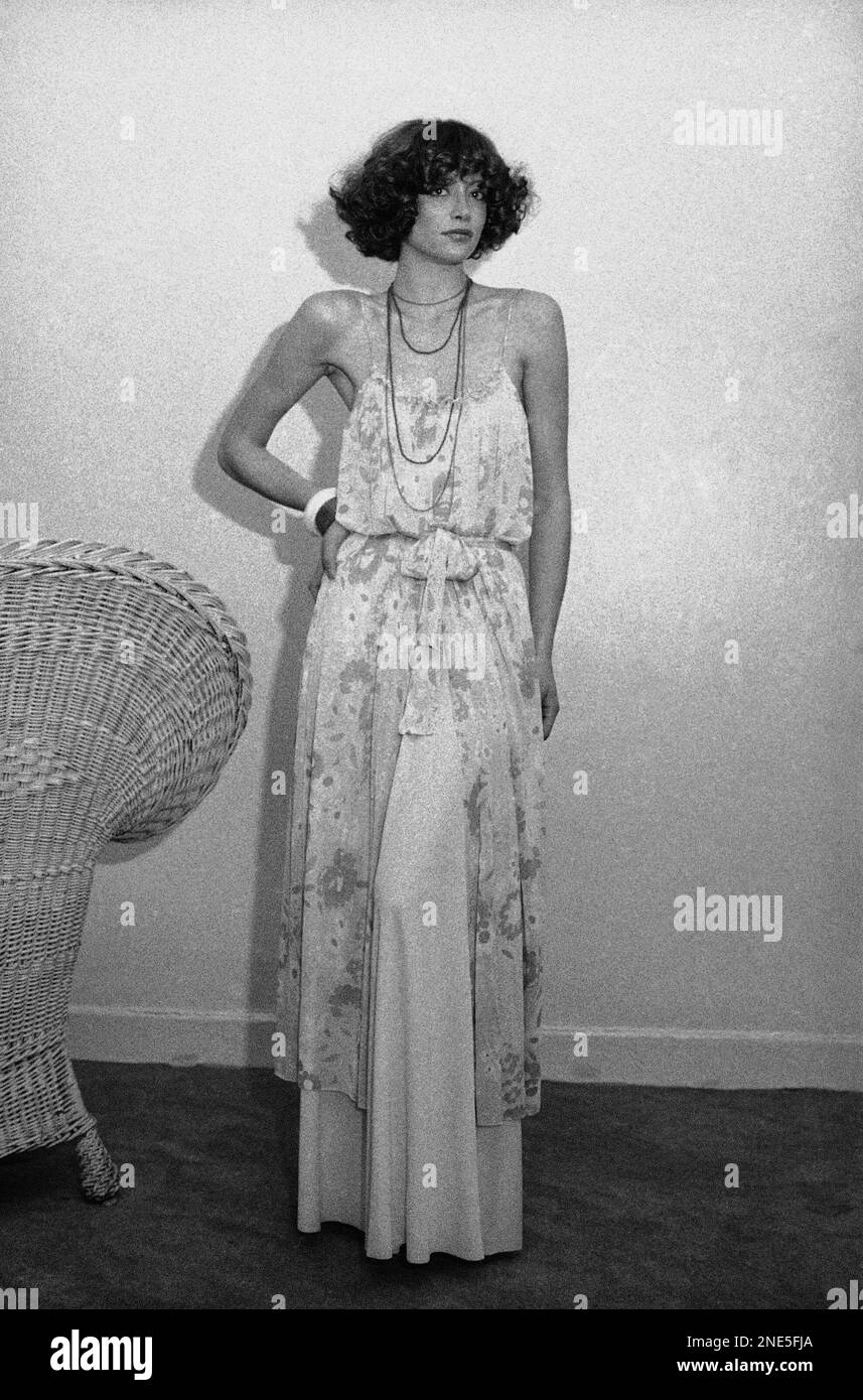 Models wears lemon chiffon gown with blousey top. Both creations were ...