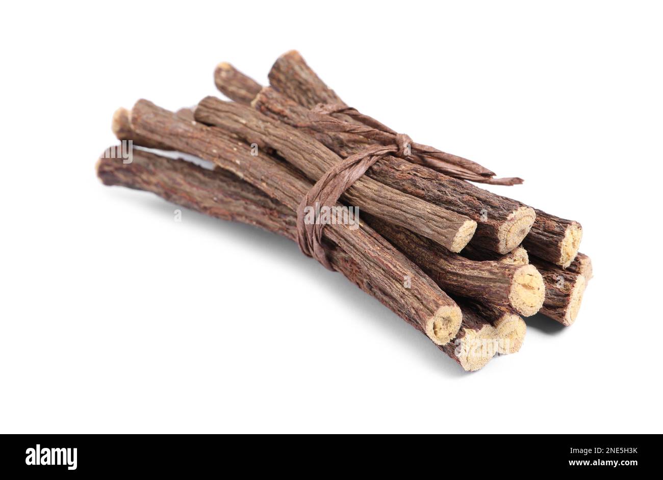 Dried sticks of liquorice root on white background Stock Photo - Alamy