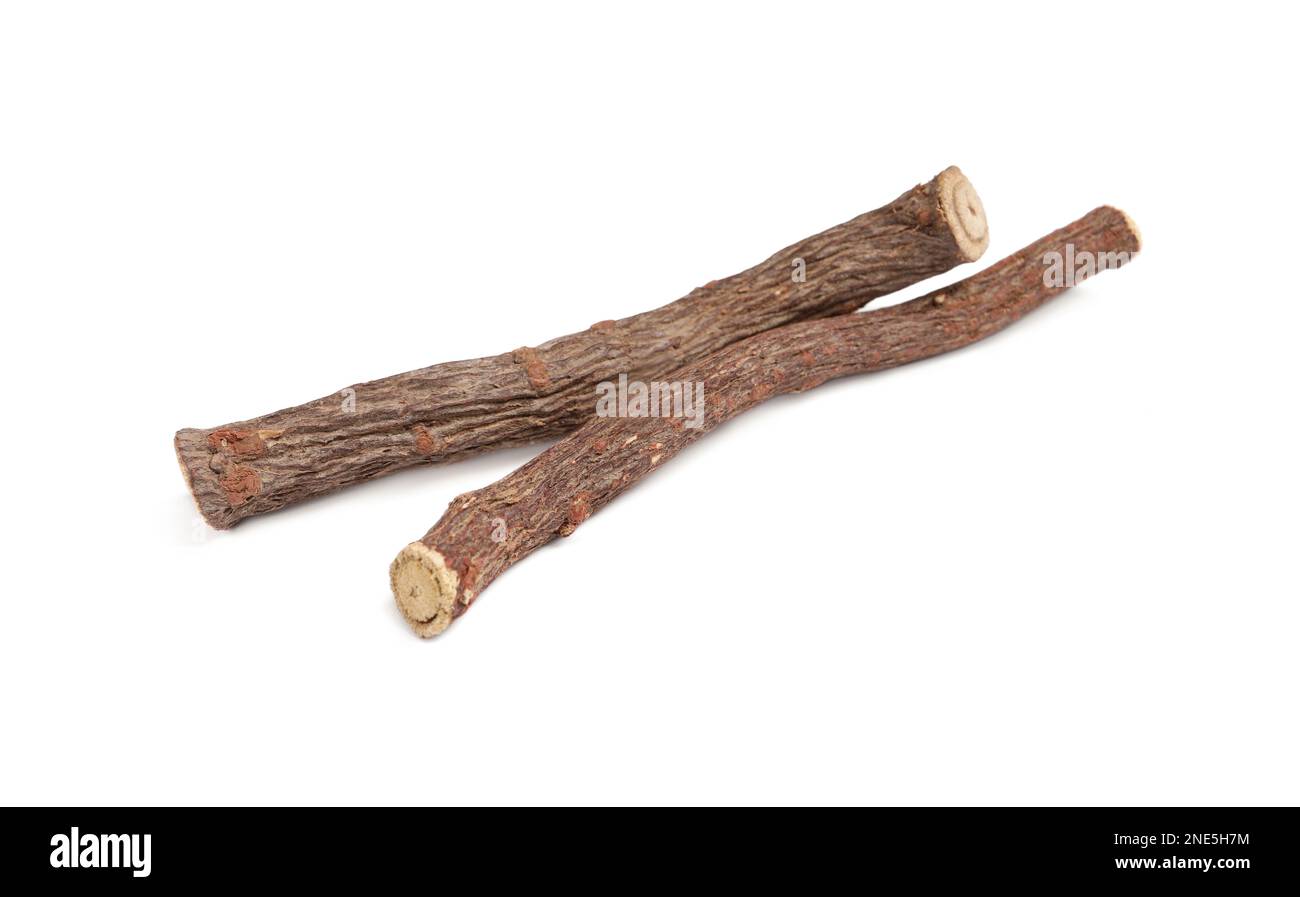 Dried sticks of liquorice root on white background Stock Photo - Alamy