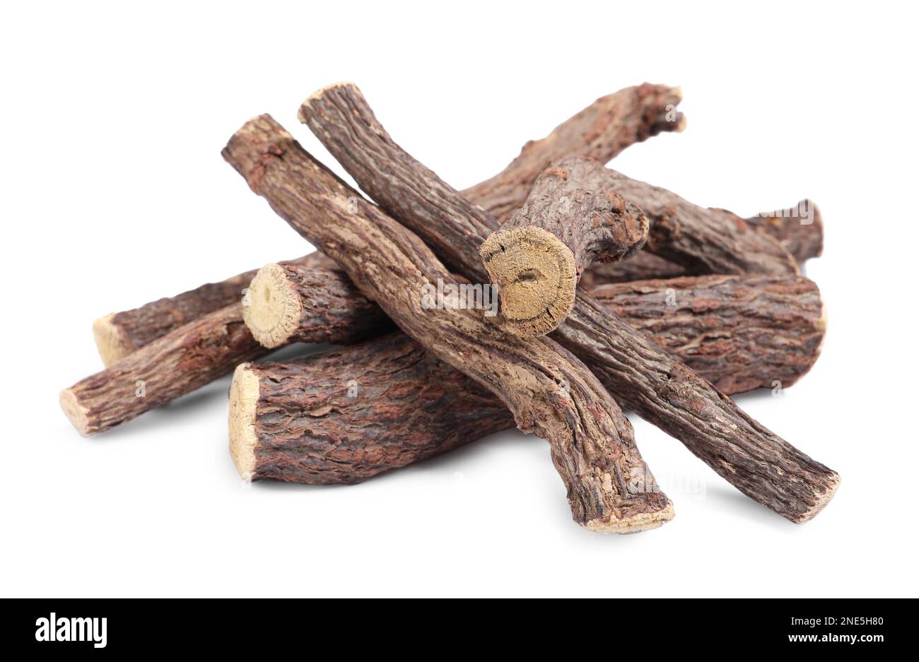 Dried sticks of liquorice root on white background Stock Photo - Alamy