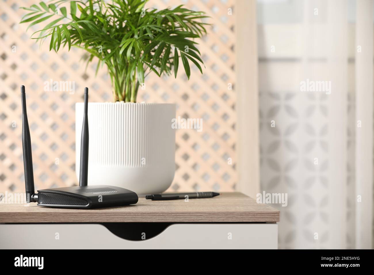 Modern Wi-Fi router indoors. Space for text Stock Photo - Alamy