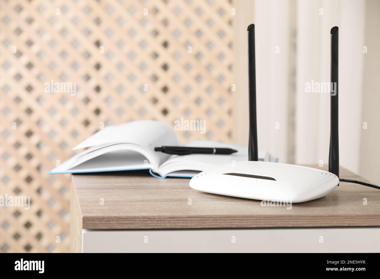 Modern Wi-Fi router indoors. Space for text Stock Photo - Alamy