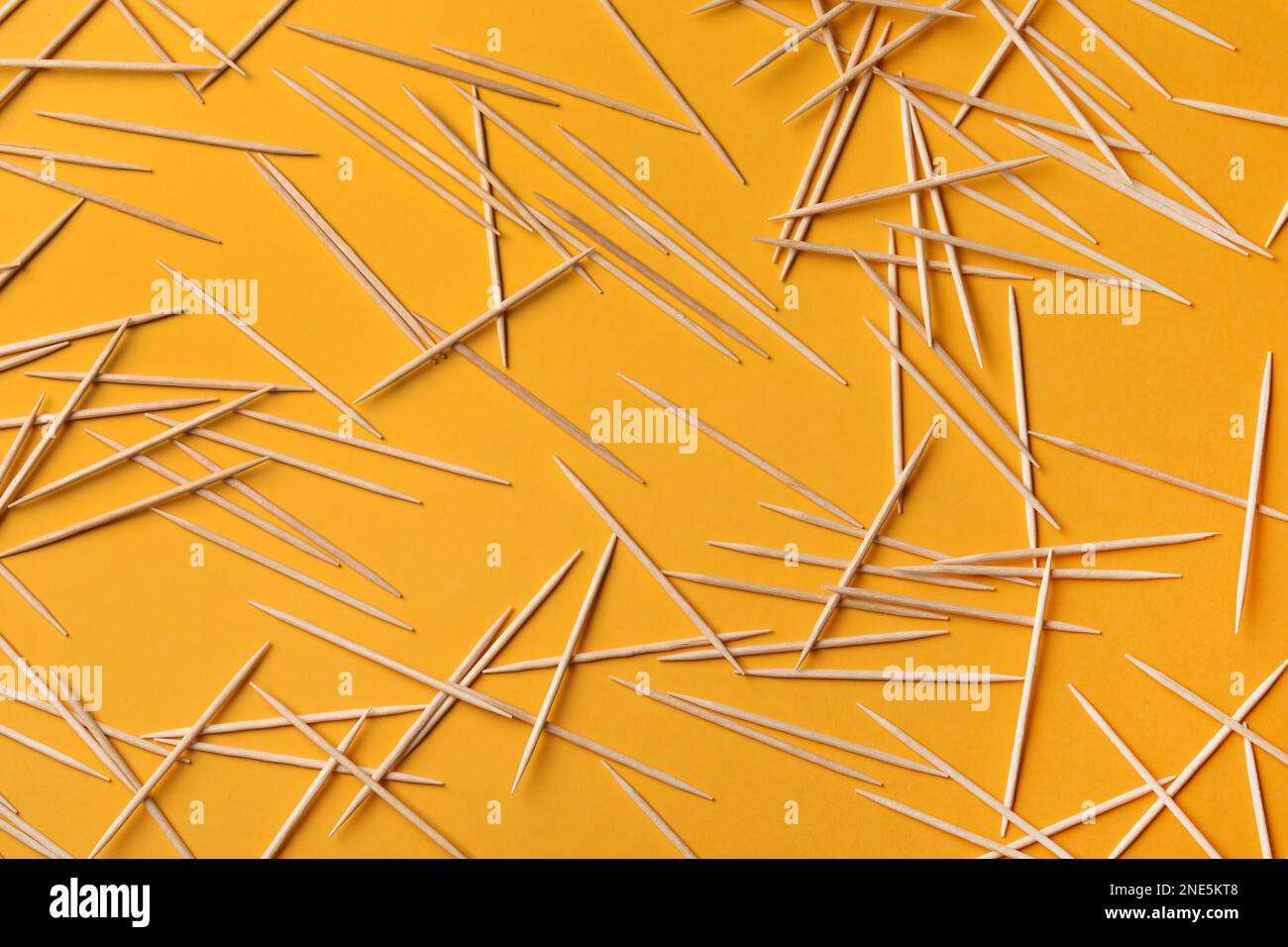 Wooden toothpicks on orange background, flat lay Stock Photo - Alamy