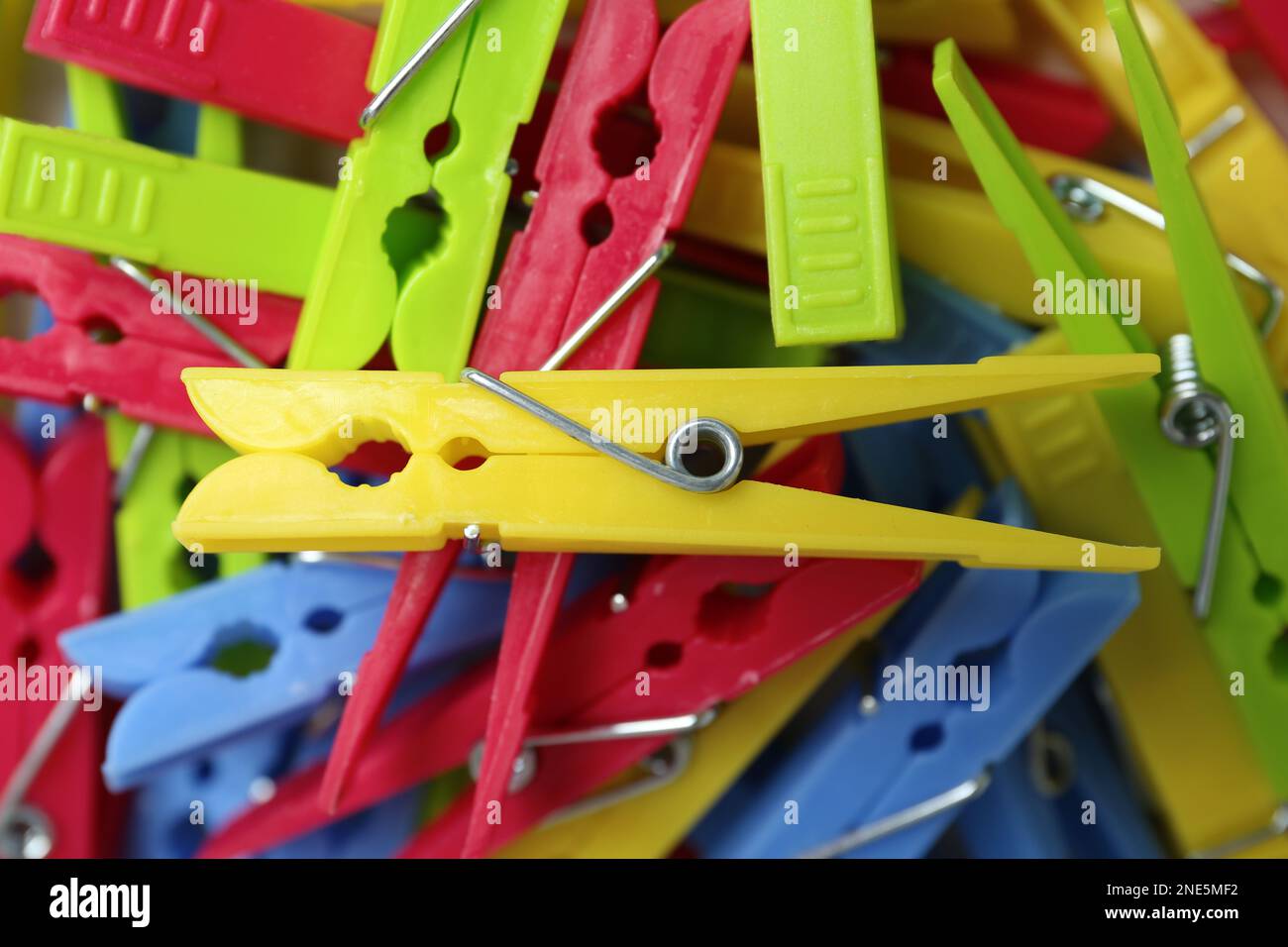 Colorful plastic clothespins as background, top view Stock Photo - Alamy
