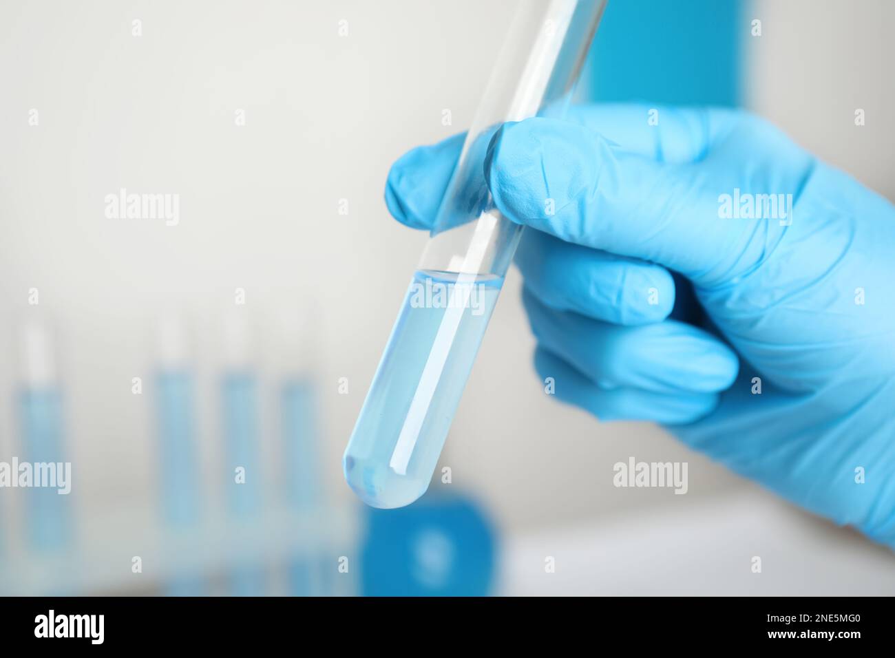 Scientist holding glass water in hi-res stock photography and images ...