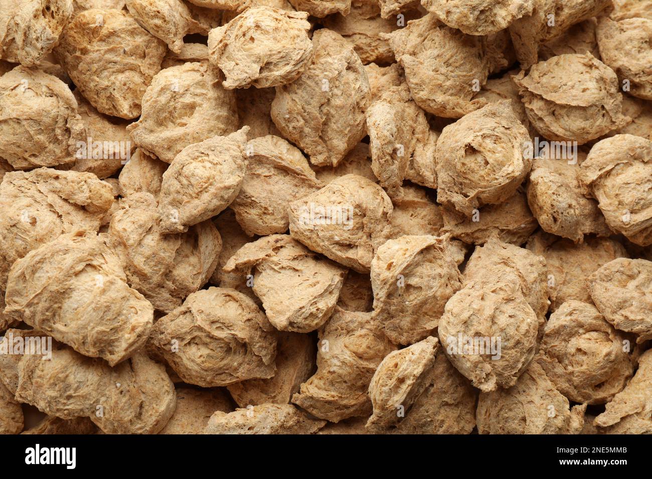 Dehydrated soy meat chunks as background, top view Stock Photo - Alamy