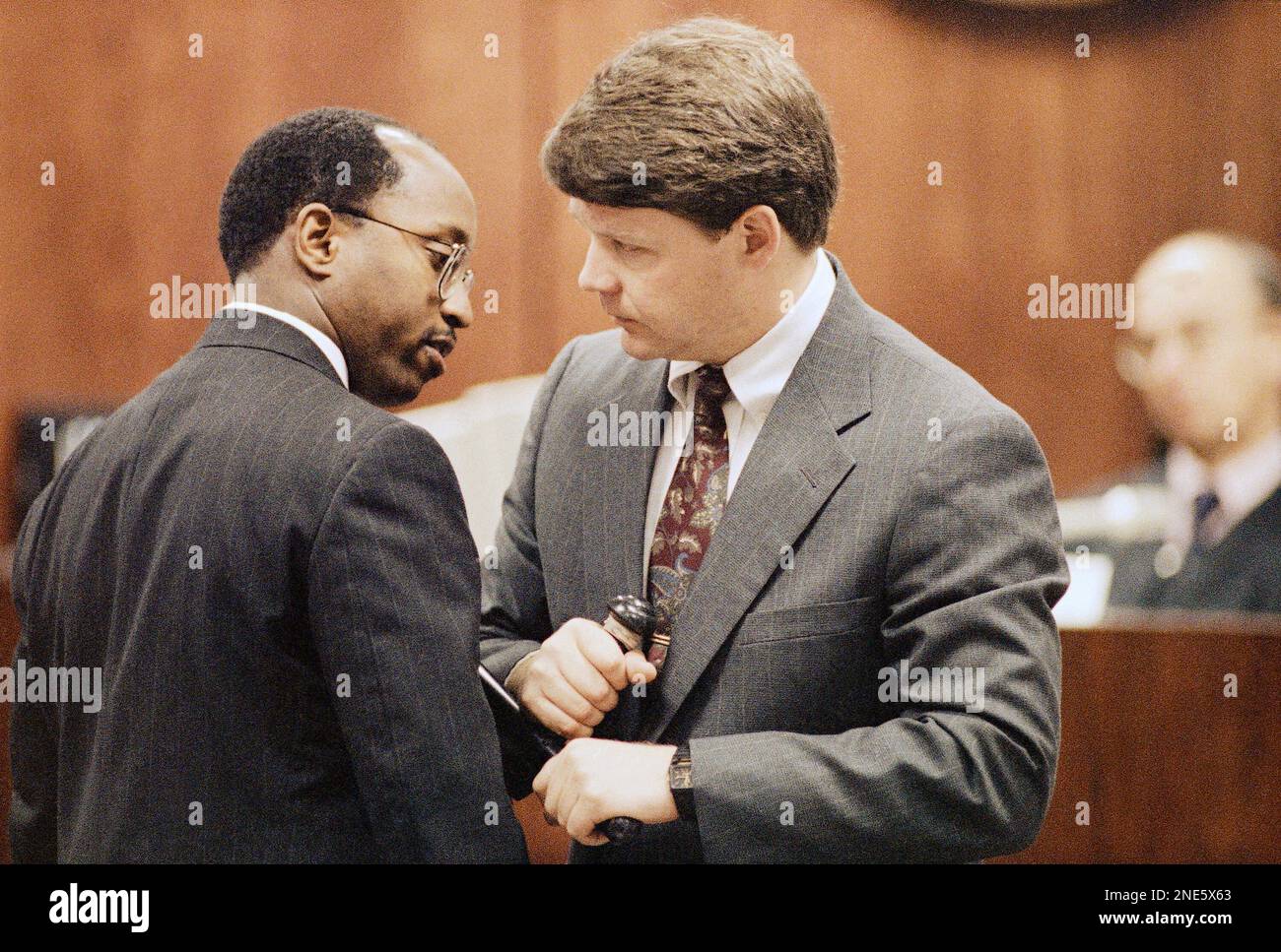 Los Angeles police officer Laurence Powell, right, reenacts the moments ...