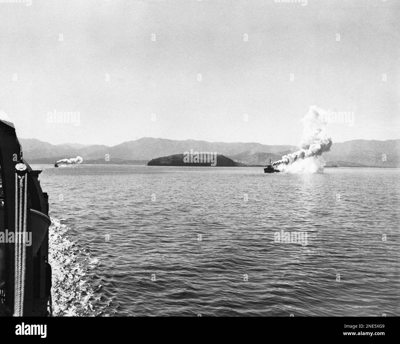 Emitting huge white clouds of protective smoke, these naval vessels ...