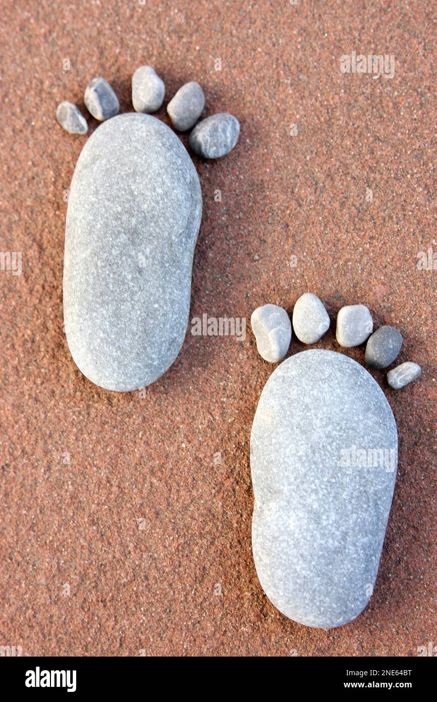 stone feet on a stone plate Stock Photo - Alamy
