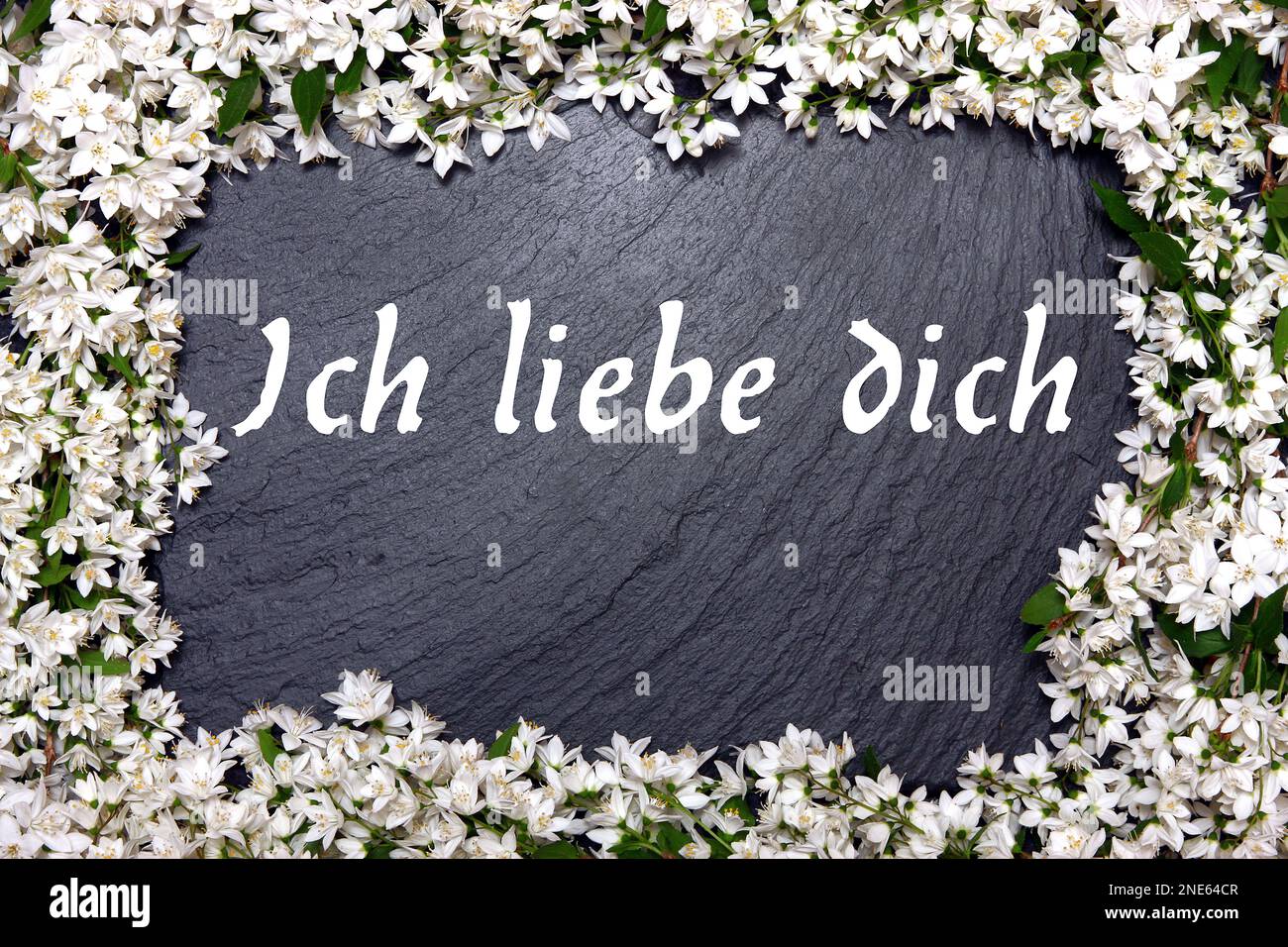 slate with white floral decoration lettering I Love You Stock Photo - Alamy