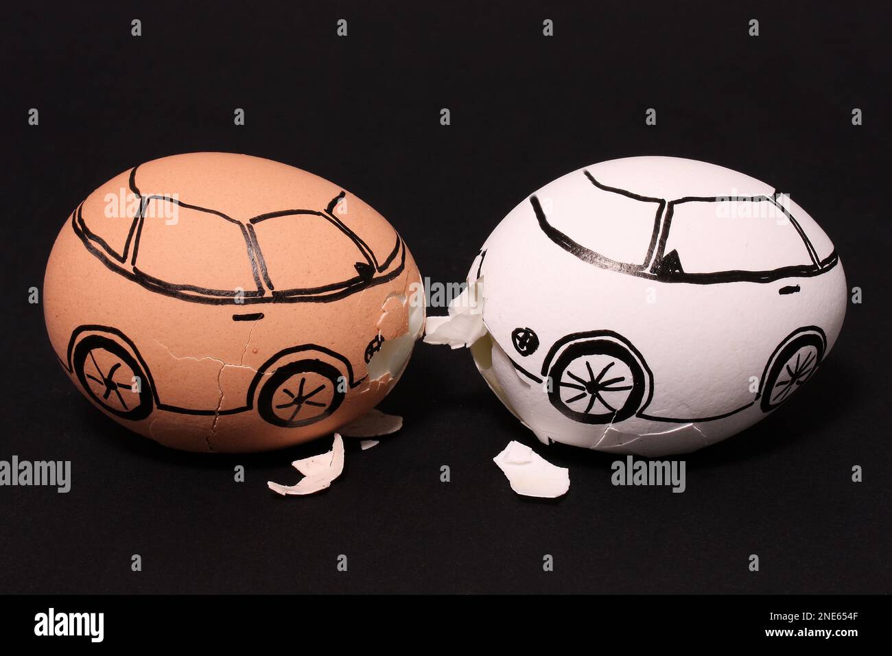 brown and white chicken egg painted as cars, car accident Stock Photo ...