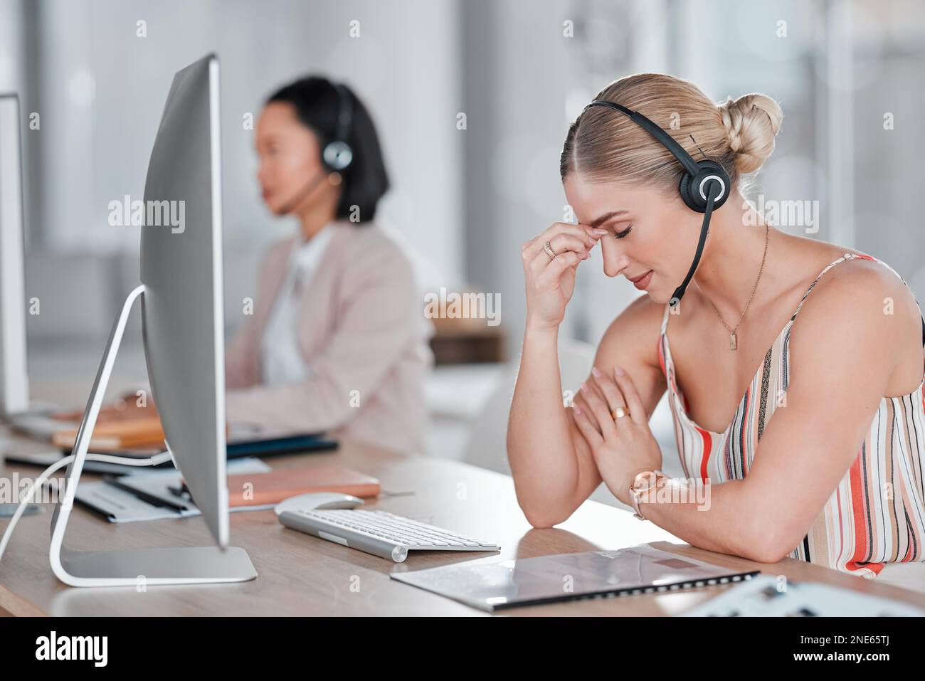 Headache, stress and burnout woman in call center feeling pain, tired ...