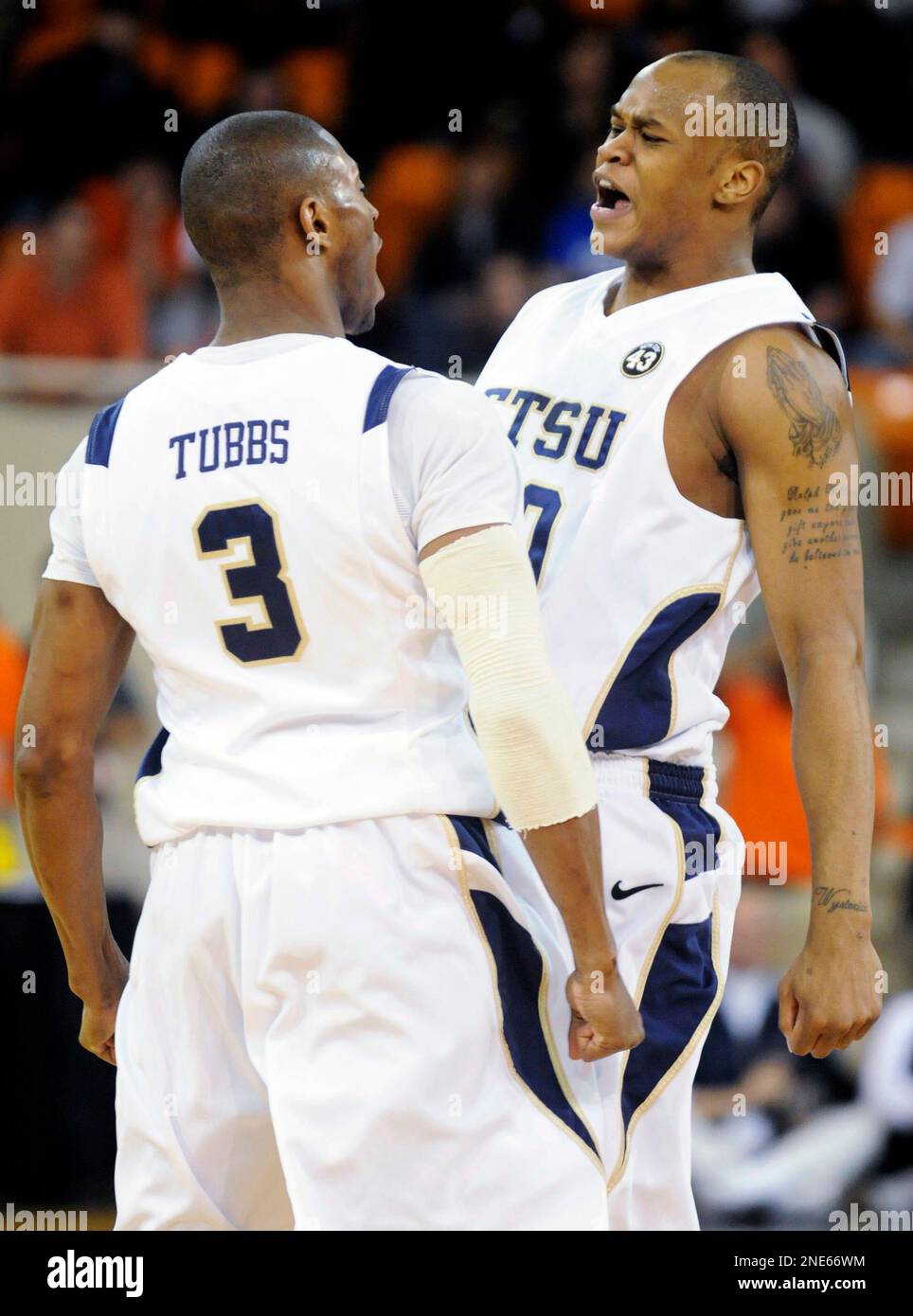 East Tennessee State guard Justin Tubbs (3) reacts with teammate Micah ...