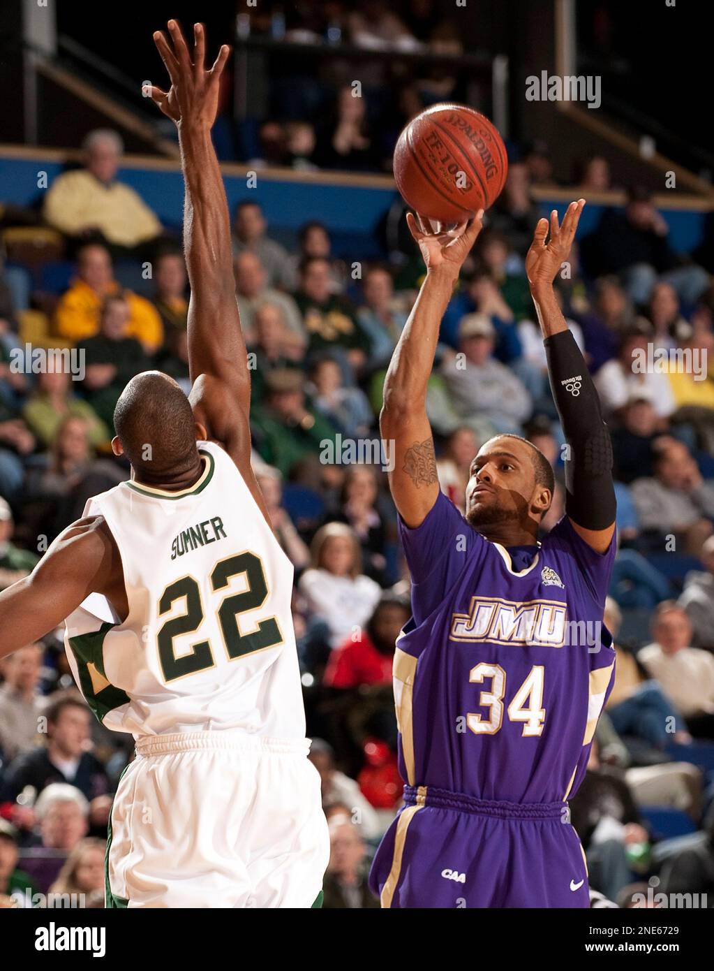 William & Mary's Danny Sumner (22) tries to block James Madison's ...