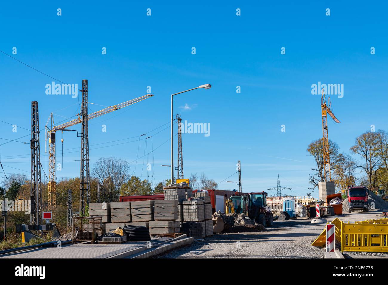 Construction site with construction machines and cranes. Road materials ...