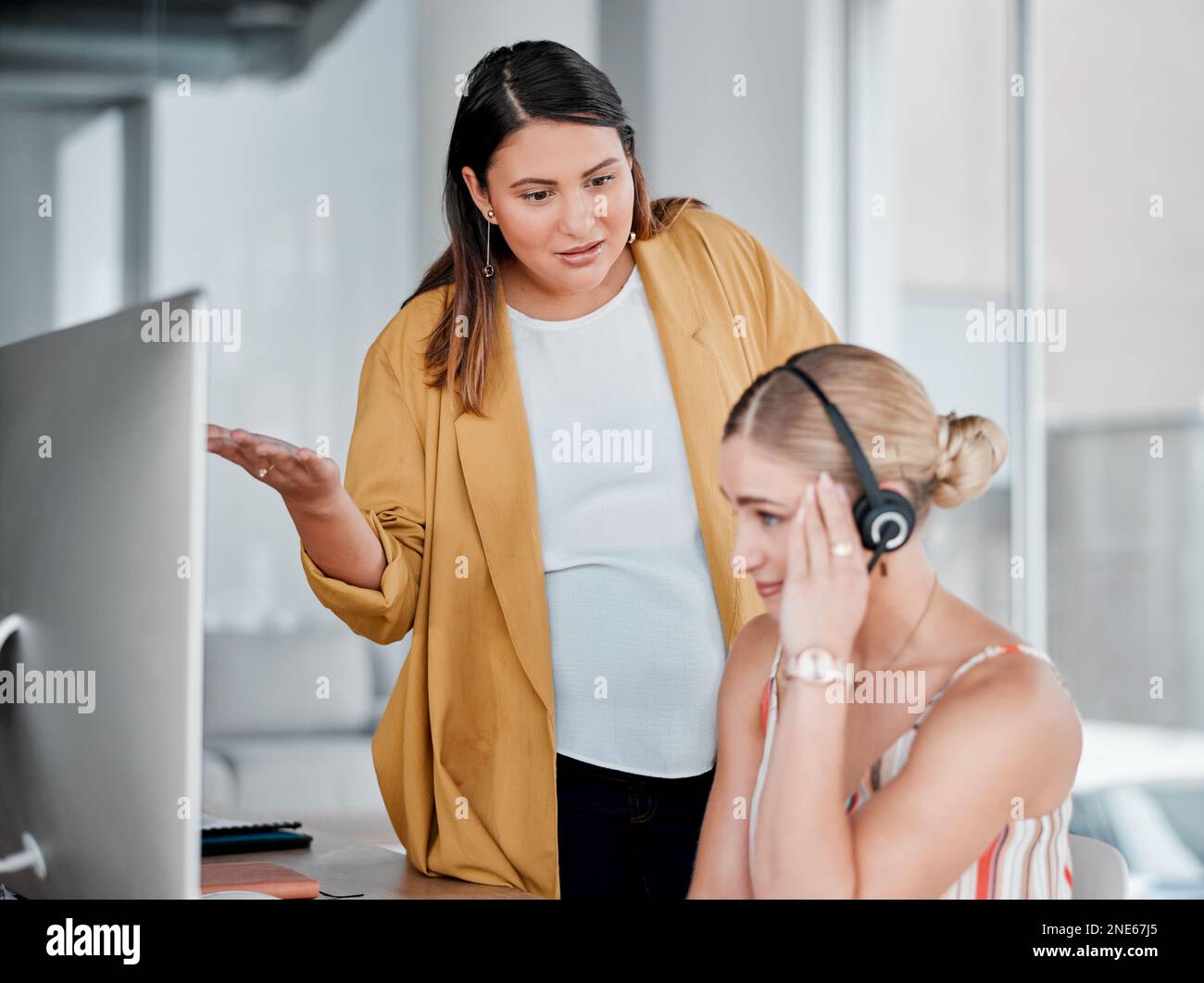 Call center, angry manager and agent at computer in office with ...