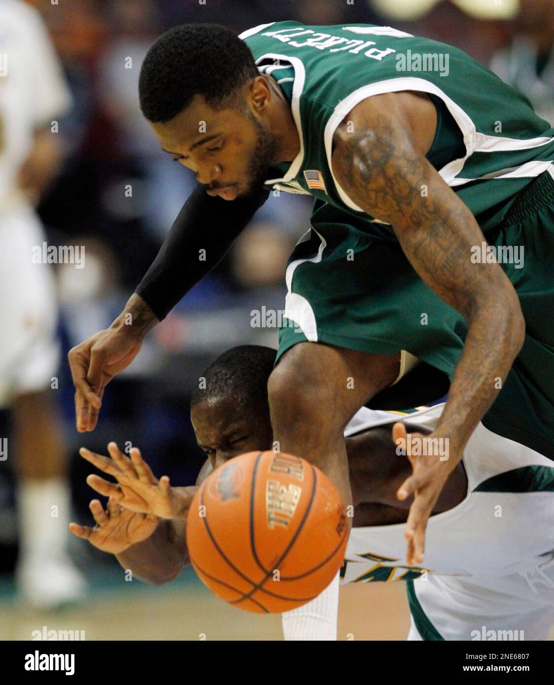 Manhattan's Rico Pickett, right, takes possession in front of Siena ...