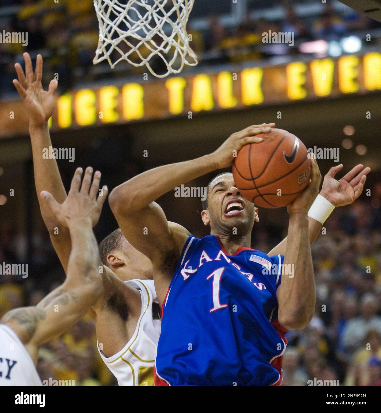Kansas's Xavier Henry, right, shoots past Missouri's Laurence Bowers ...