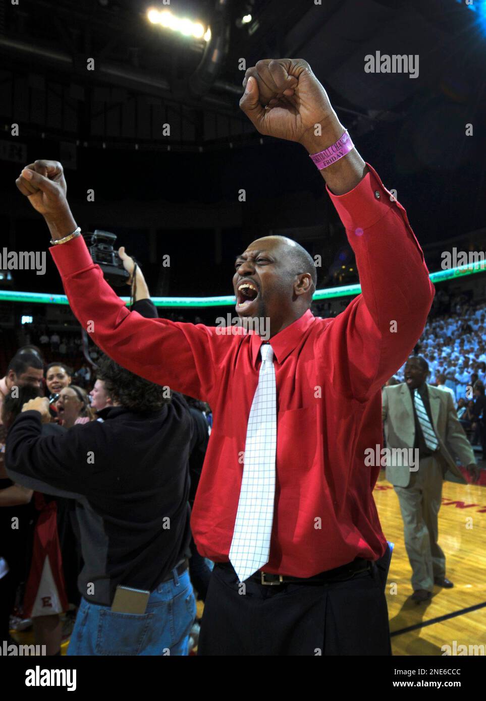 Des Moines East's head coach Sam Powell rects after beating Waukee in a ...