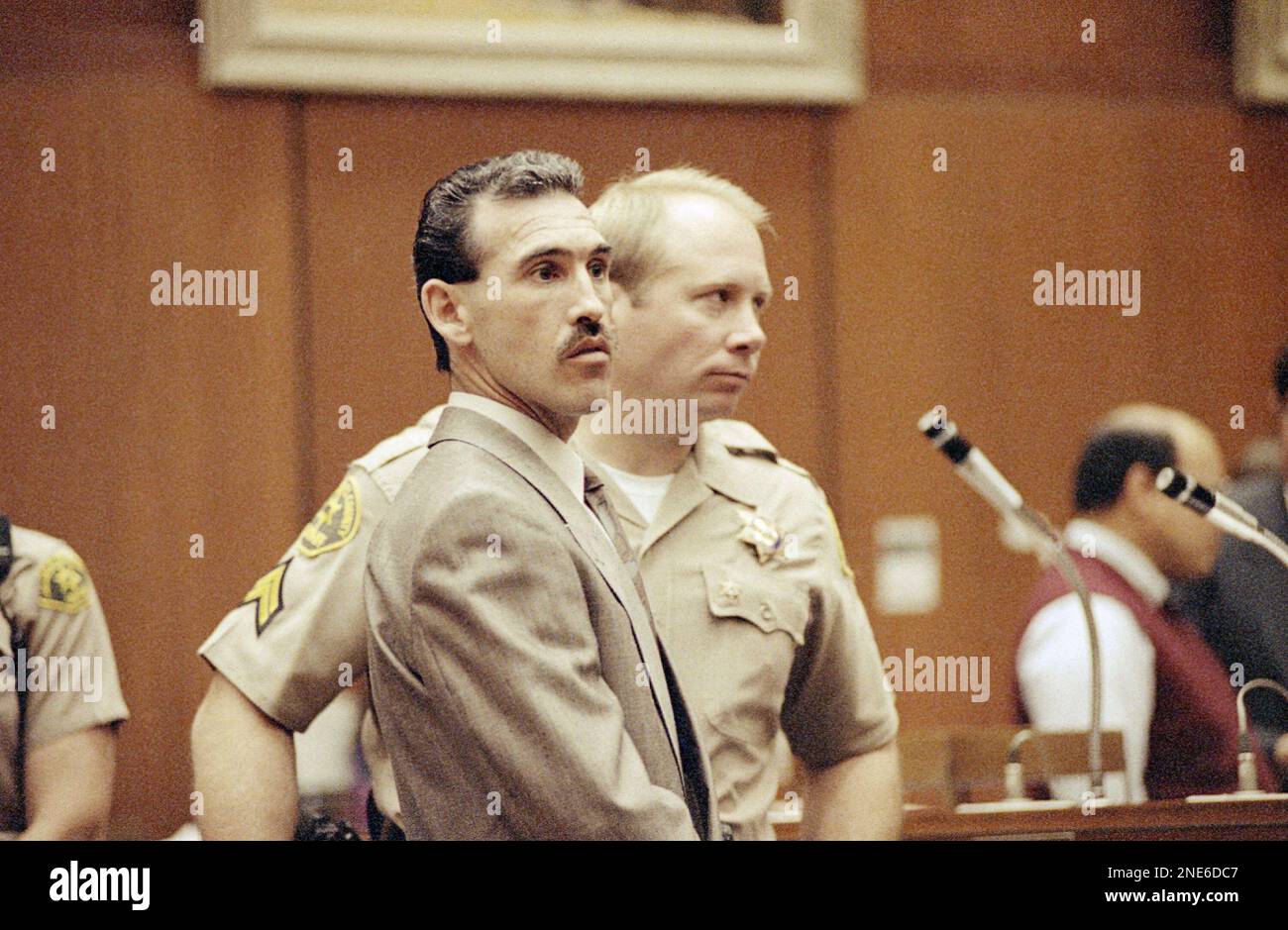 Los Angeles police officer Ted Briseno, left, and three other LAPD ...
