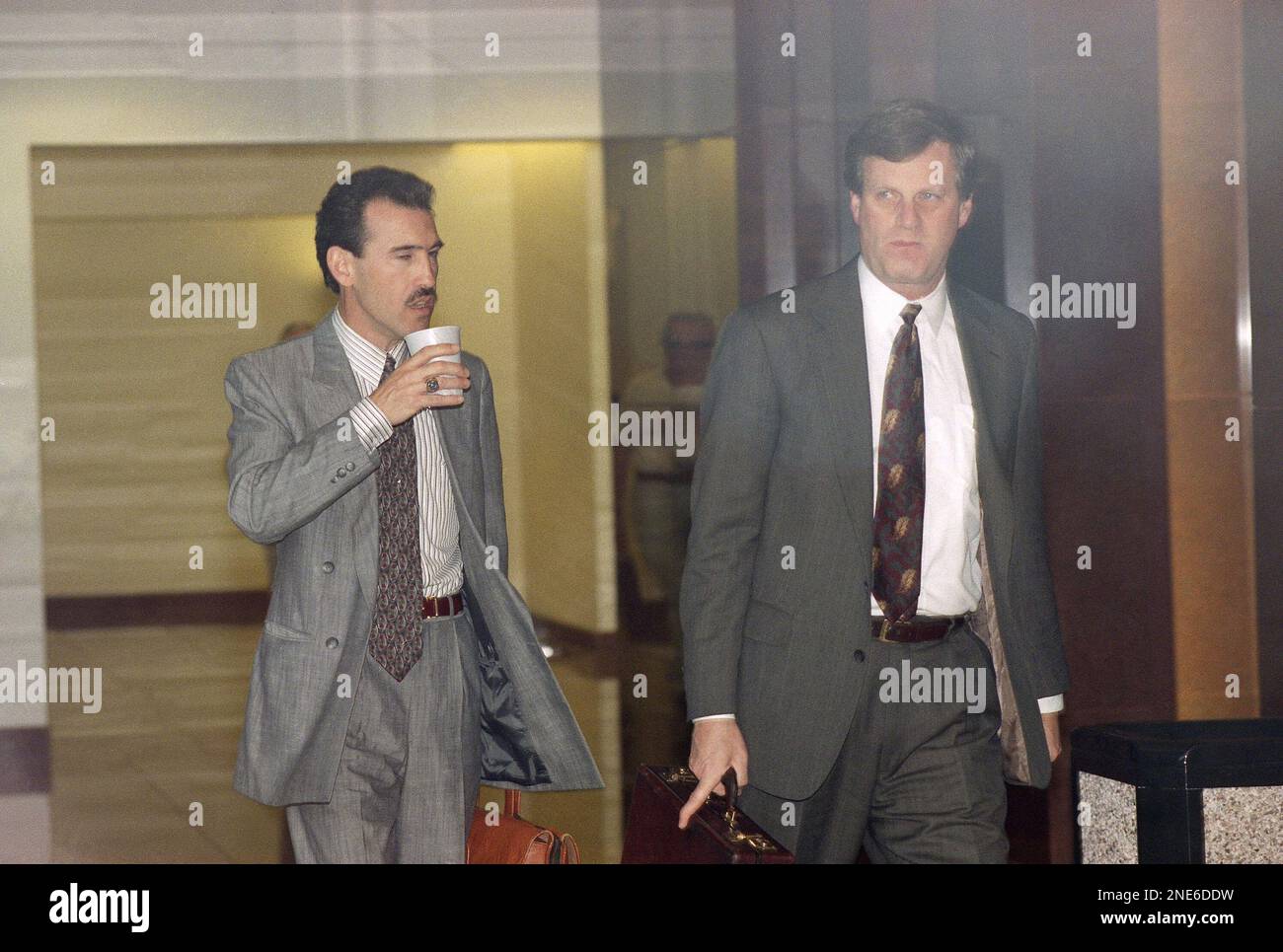 Theodore Briseno, left, and his lawyer, Harland Braun, arrive at the ...